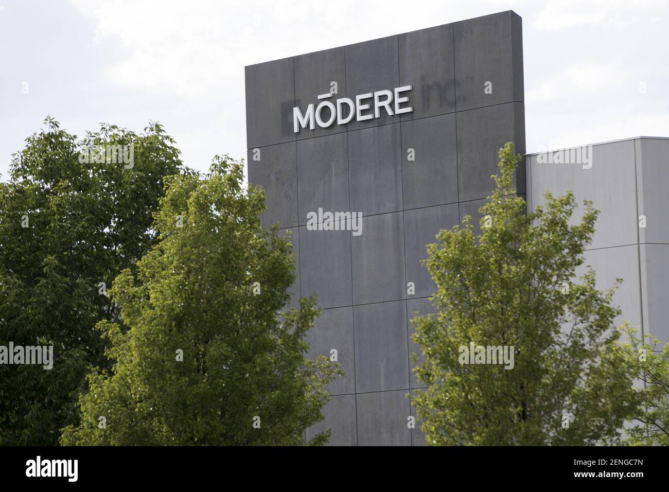 A logo sign outside of the headquarters of Modere in Springville, Utah ...
