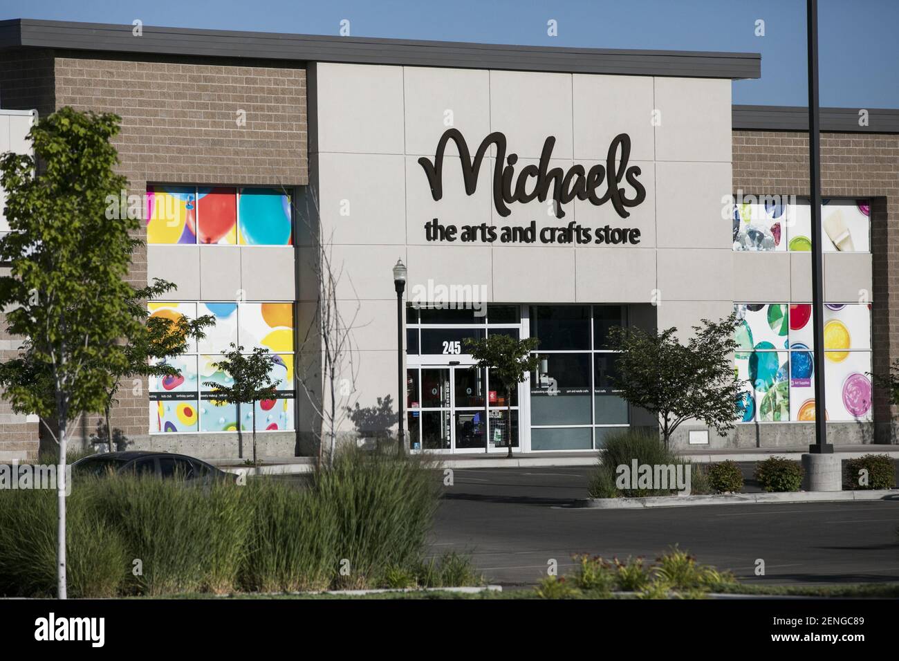 A logo sign outside of a Michaels retail store location in American ...