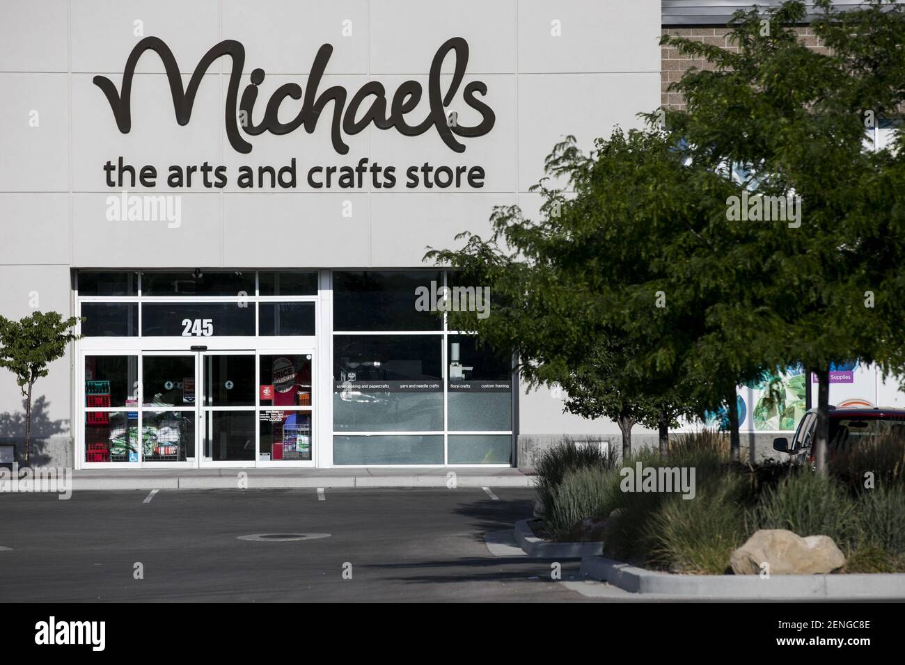 A logo sign outside of a Michaels retail store location in American ...
