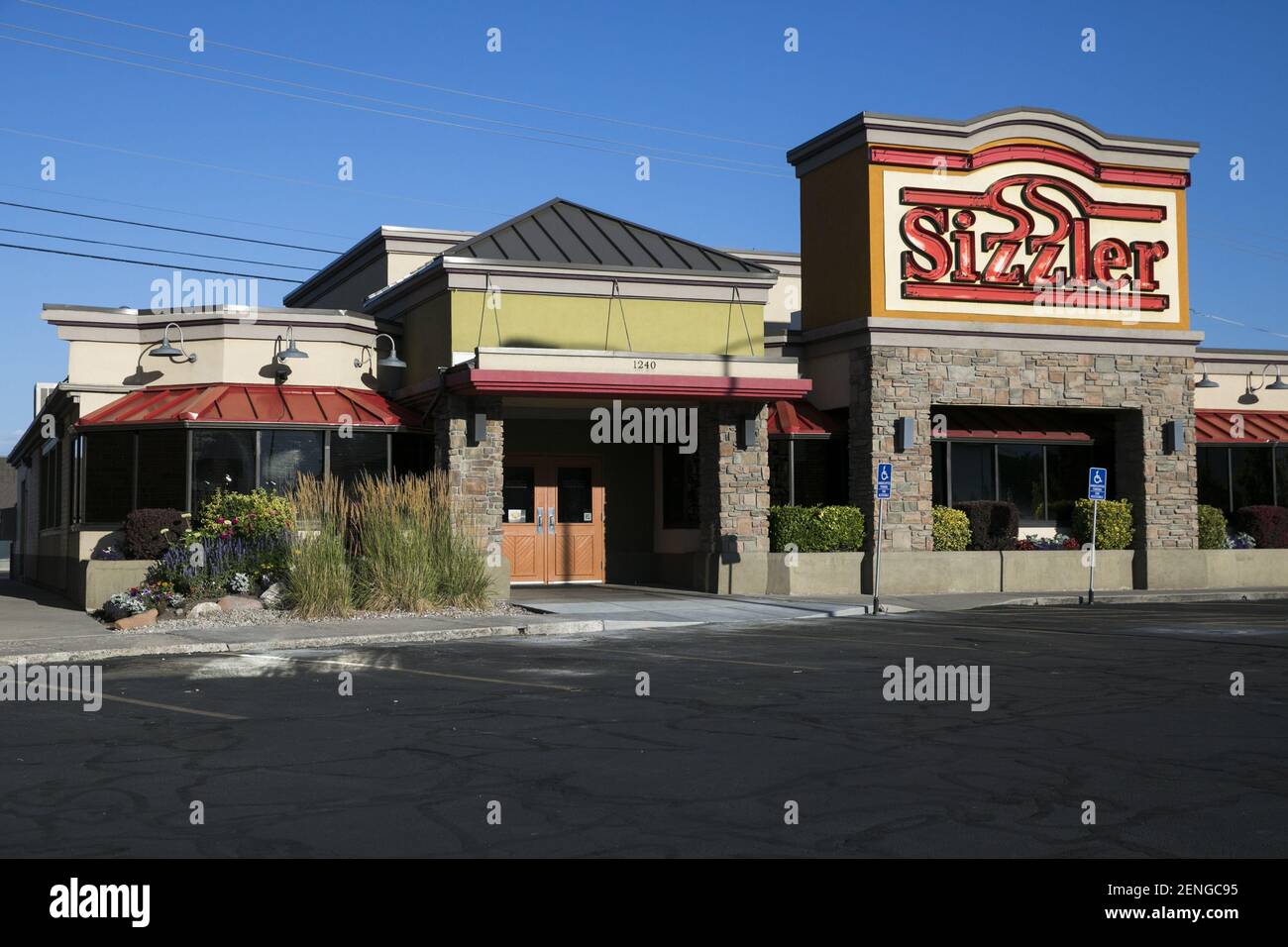 A logo sign outside of a Sizzler restaurant location in Orem, Utah on ...