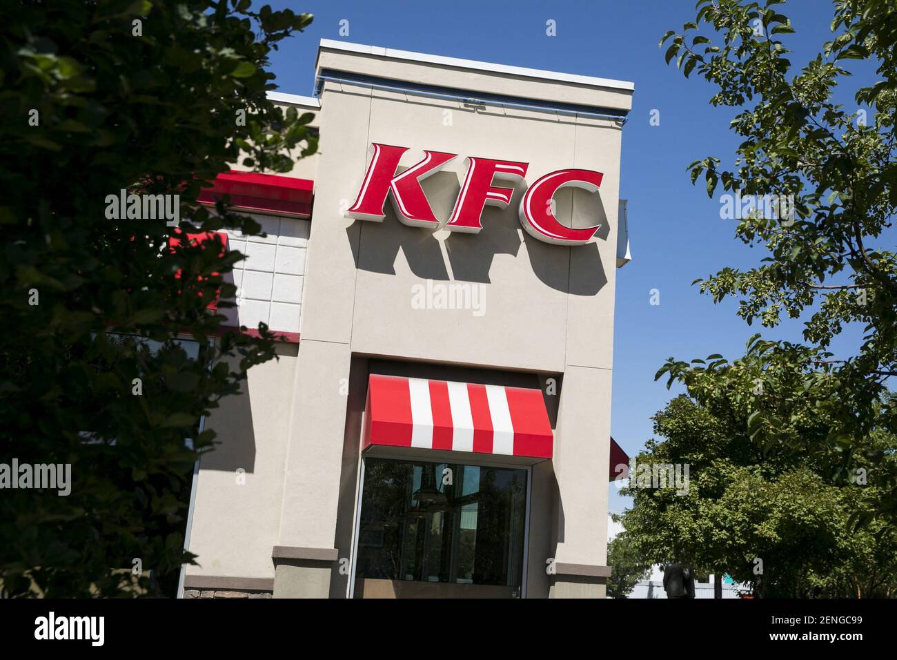 A logo sign outside of the first Kentucky Fried Chicken (KFC) franchise ...