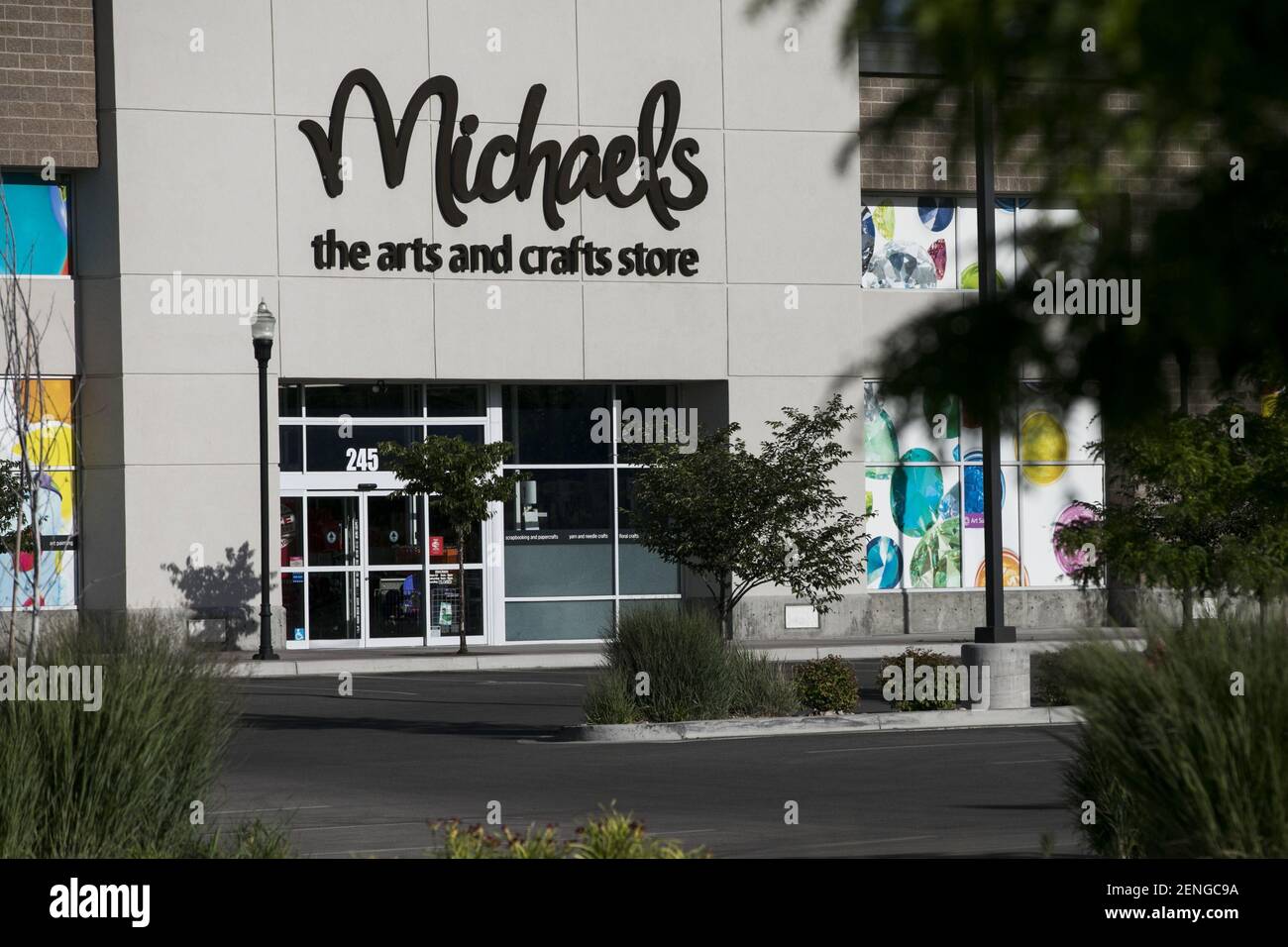 A logo sign outside of a Michaels retail store location in American ...