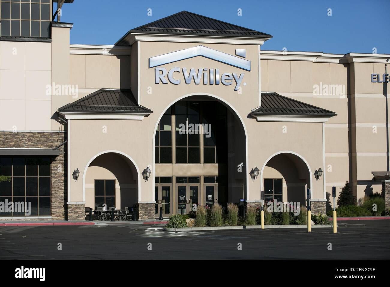 A logo sign outside of a RC Willey Home Furnishings retail store ...