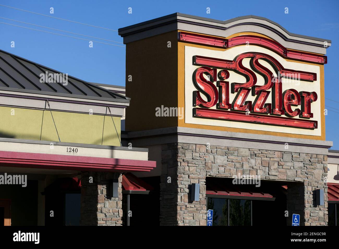 A logo sign outside of a Sizzler restaurant location in Orem, Utah on ...