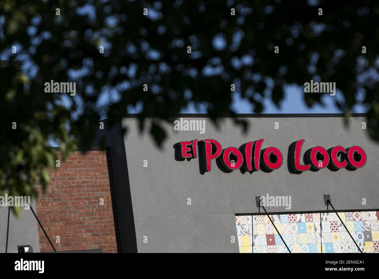 A logo sign outside of a El Pollo Loco fast food restaurant location in ...