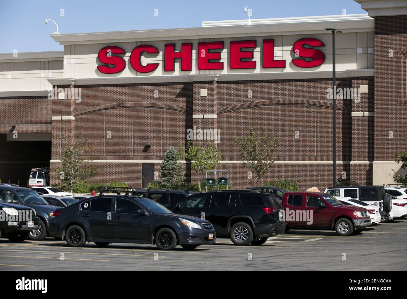 A logo sign outside of a SCHEELS retail store location in Sandy, Utah ...