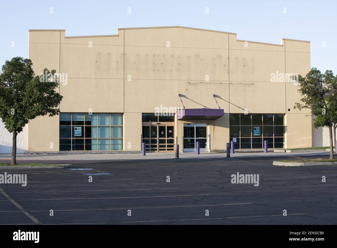 The faded outline of a logo sign outside of an abandoned Kids "R" Us ...