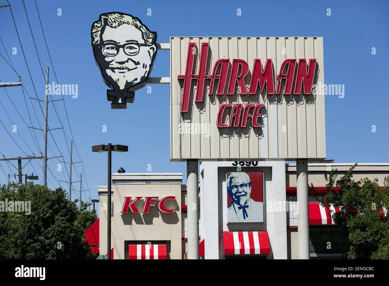 A Harlan Cafe logo sign outside of the first Kentucky Fried Chicken ...