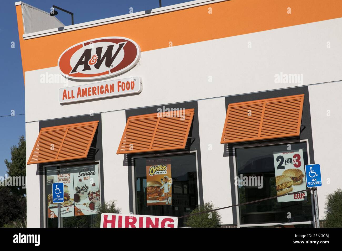 A logo sign outside of a A&W fast food restaurant location in American ...