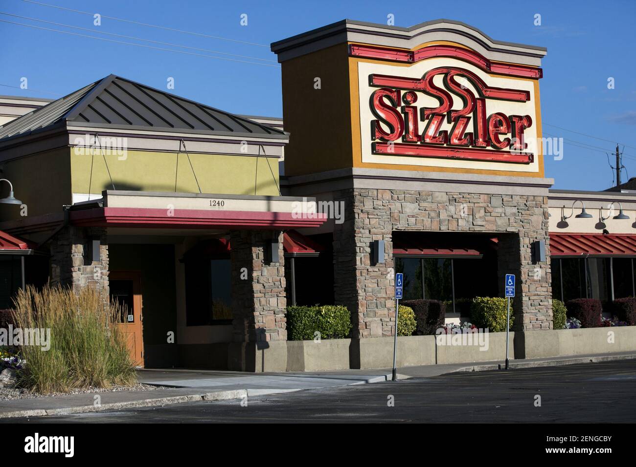 A logo sign outside of a Sizzler restaurant location in Orem, Utah on ...