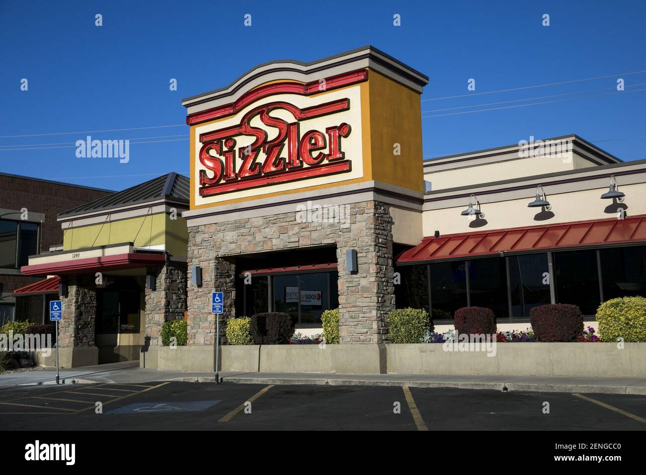 A logo sign outside of a Sizzler restaurant location in Orem, Utah on ...