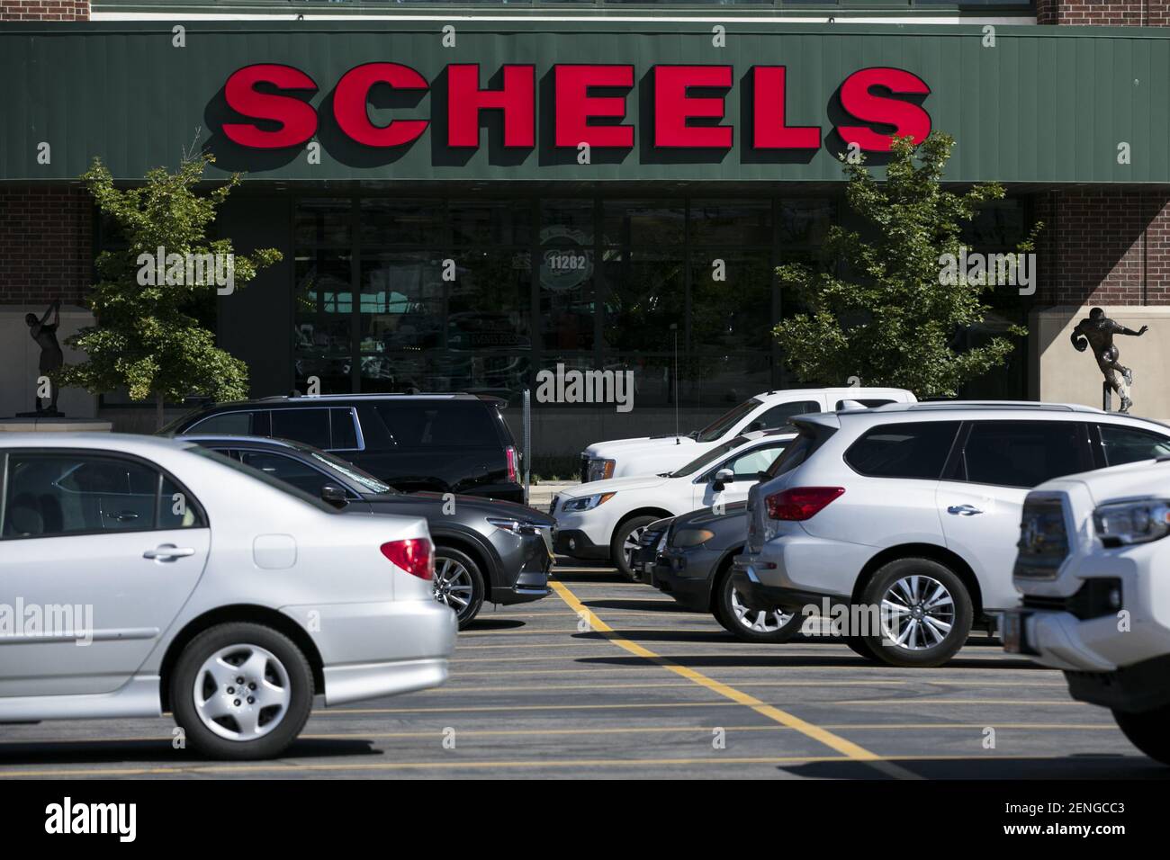 A logo sign outside of a SCHEELS retail store location in Sandy, Utah ...