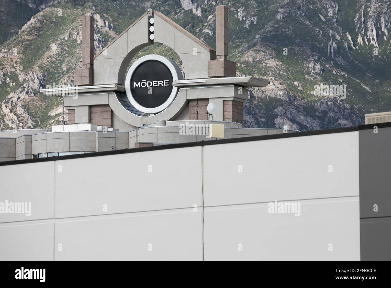 A logo sign outside of the headquarters of Modere in Springville, Utah ...