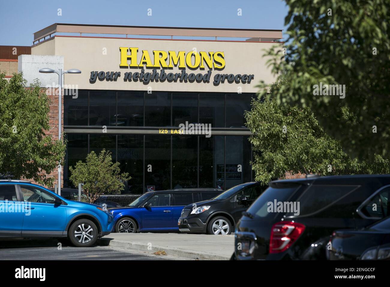 A logo sign outside of a Harmons retail grocery store location in Lehi ...
