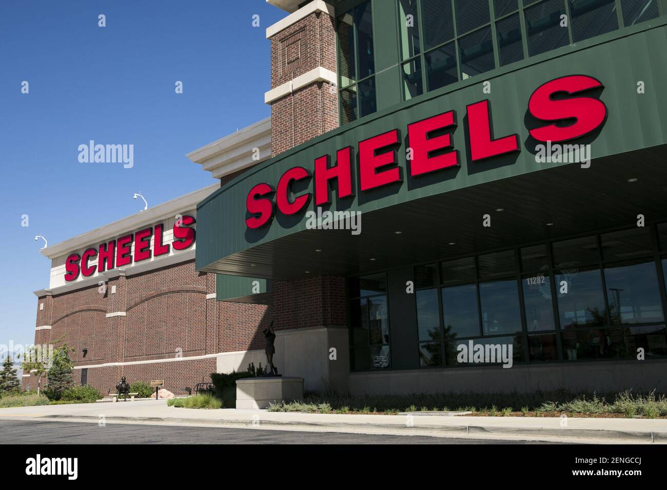 A logo sign outside of a SCHEELS retail store location in Sandy, Utah ...