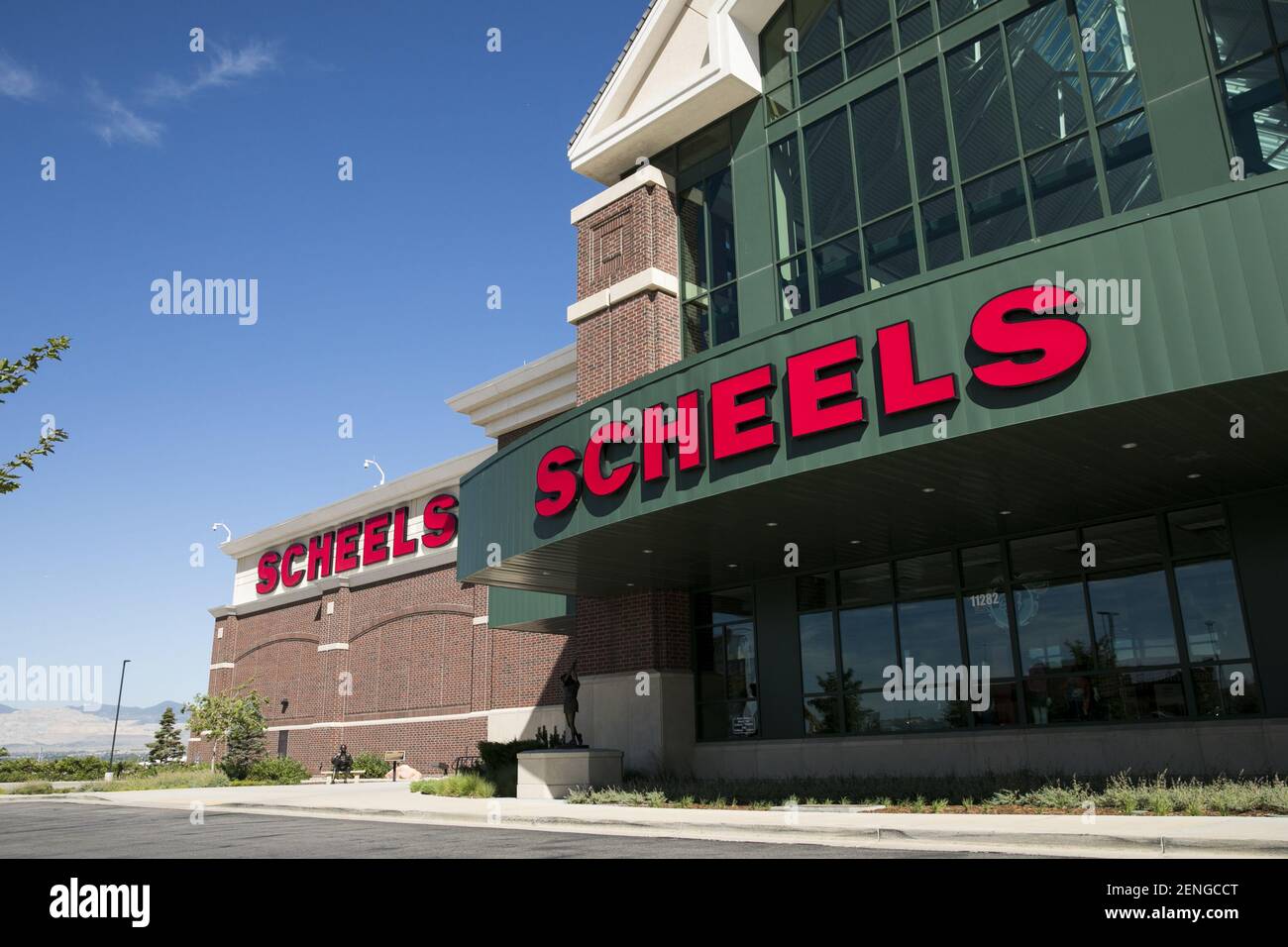 A logo sign outside of a SCHEELS retail store location in Sandy, Utah ...
