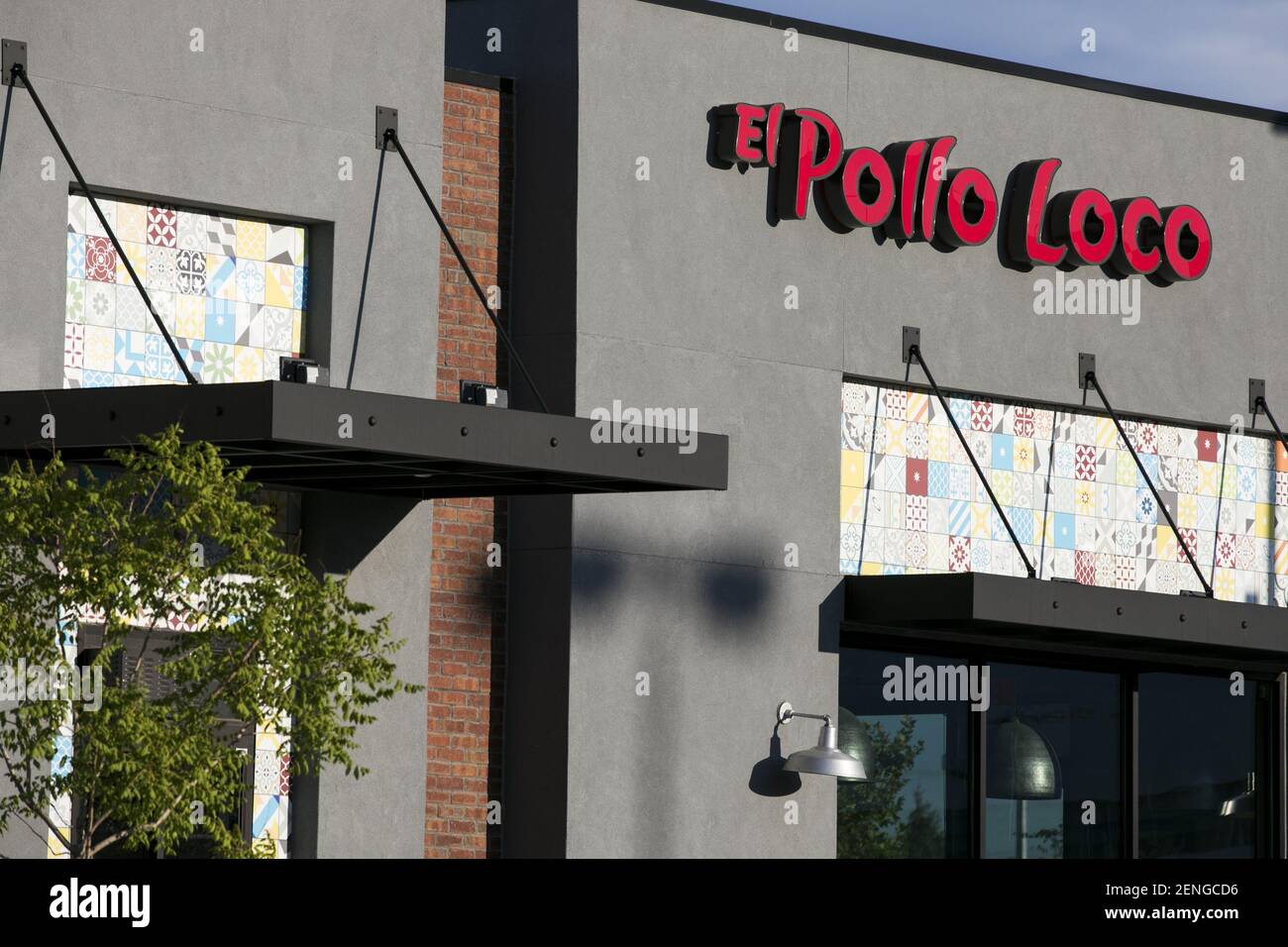 A logo sign outside of a El Pollo Loco fast food restaurant location in ...