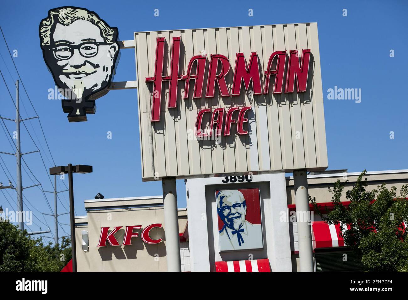A Harlan Cafe logo sign outside of the first Kentucky Fried Chicken ...
