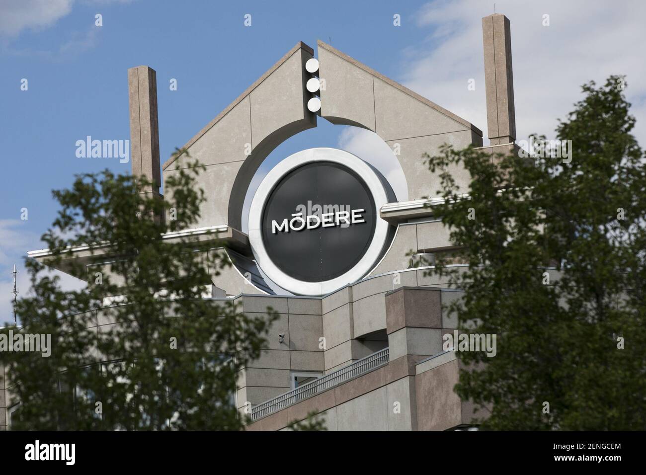 A logo sign outside of the headquarters of Modere in Springville, Utah ...
