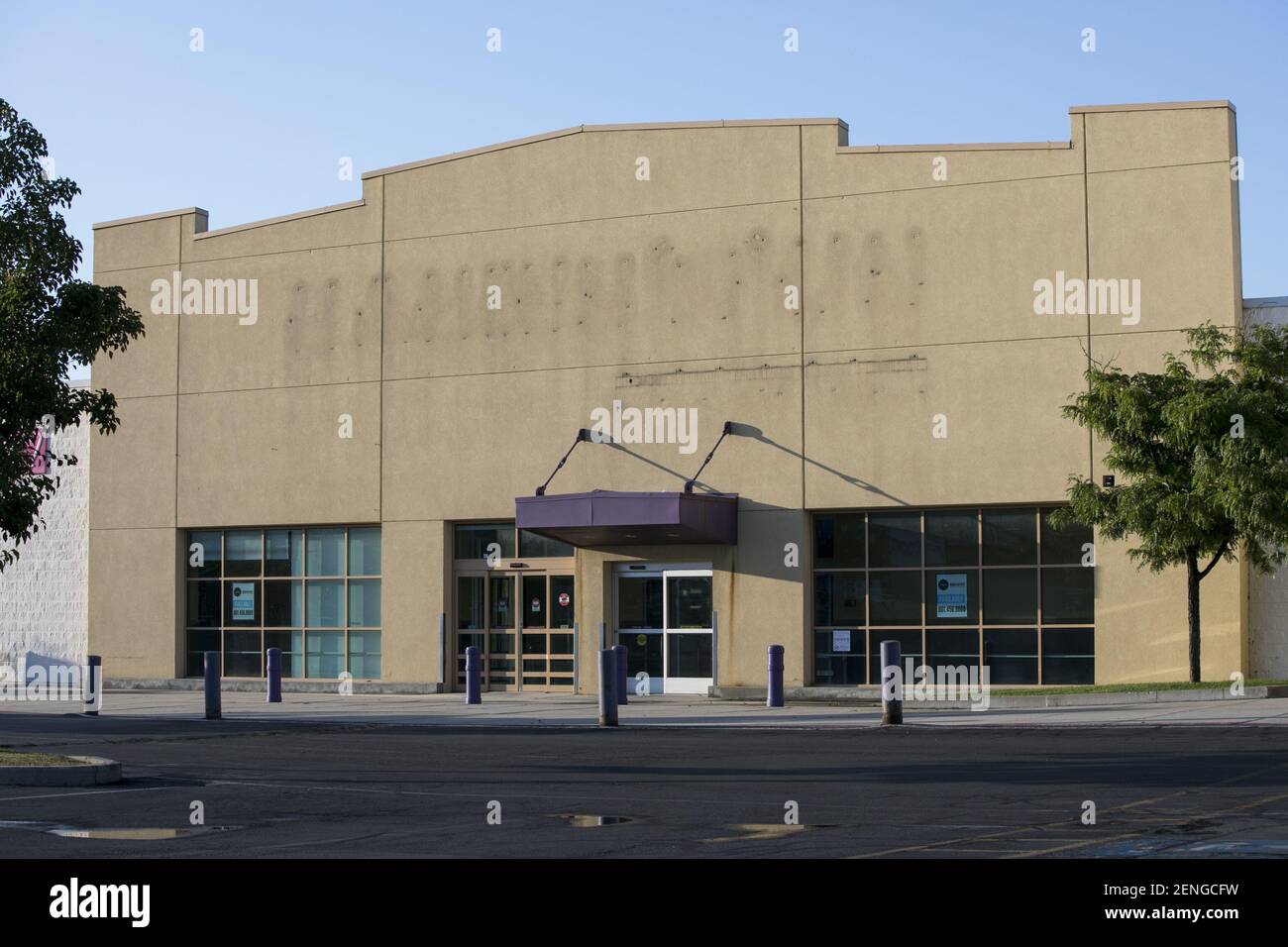 The faded outline of a logo sign outside of an abandoned Kids "R" Us ...