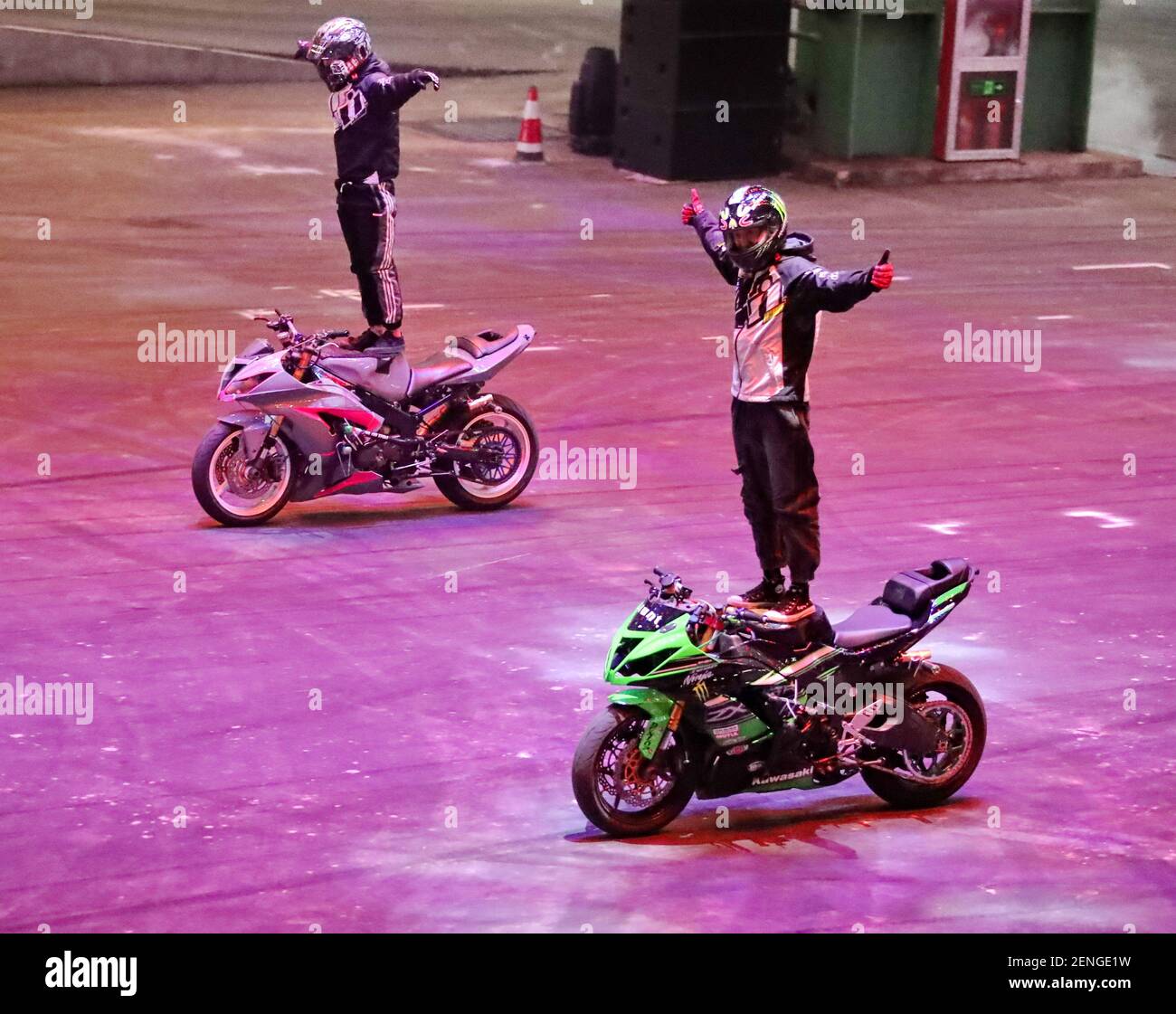 Members of car racing acrobatic teams perform during the reopening ...