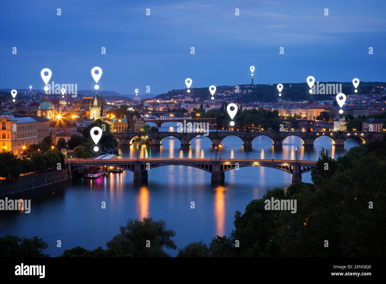 Map pin icons on Prague cityscape. Lit buildings and bridges over ...