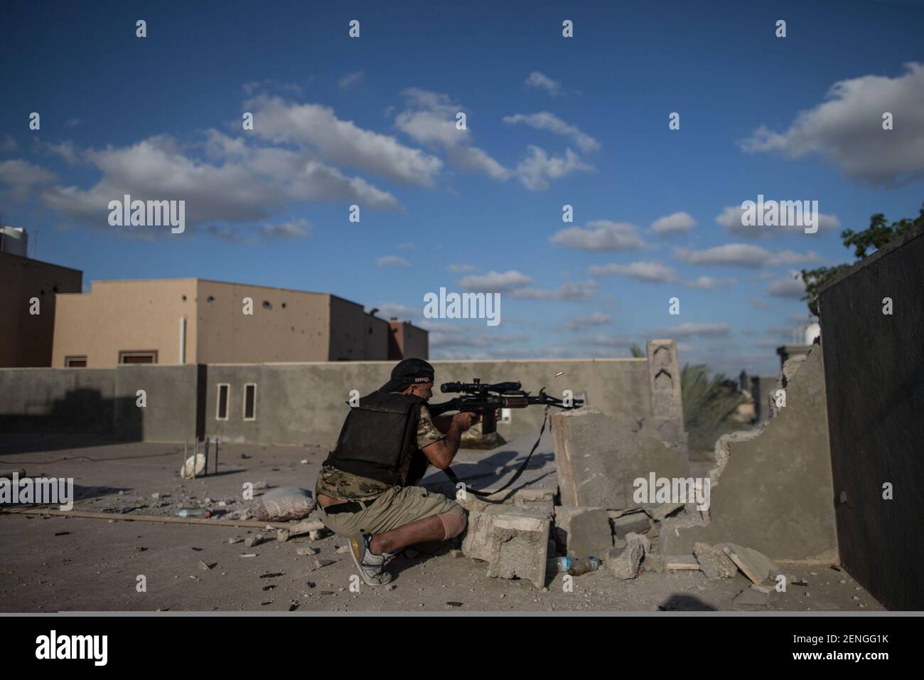 A sniper of the UN-backed Government of National Accord (GNA) fires at ...