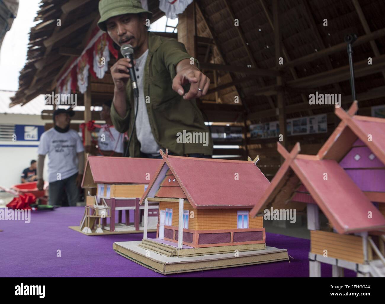 An Indonesian architect, showing a miniature earthquake-resistant house ...