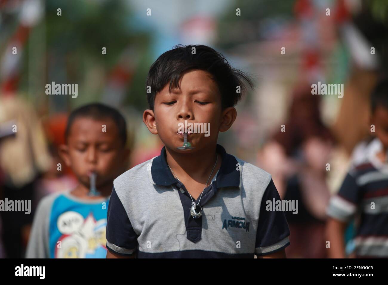 Indonesian children take part in a competition traditional games to ...