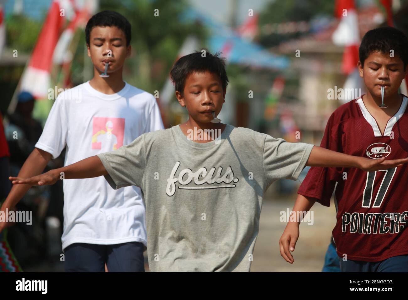 Indonesian children take part in a competition traditional games to ...