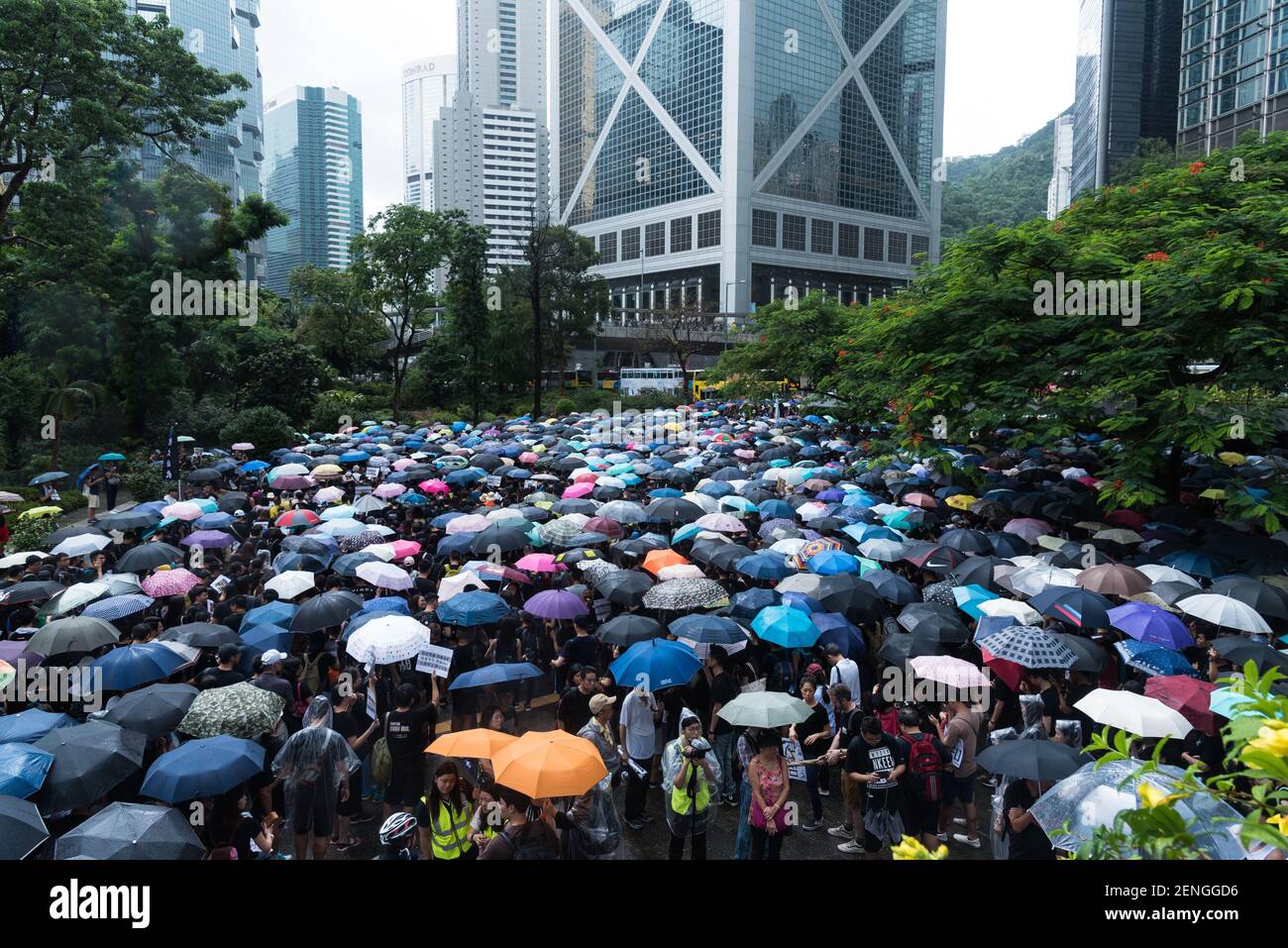 Protesters march in the rain during the demonstration. Thousands of ...