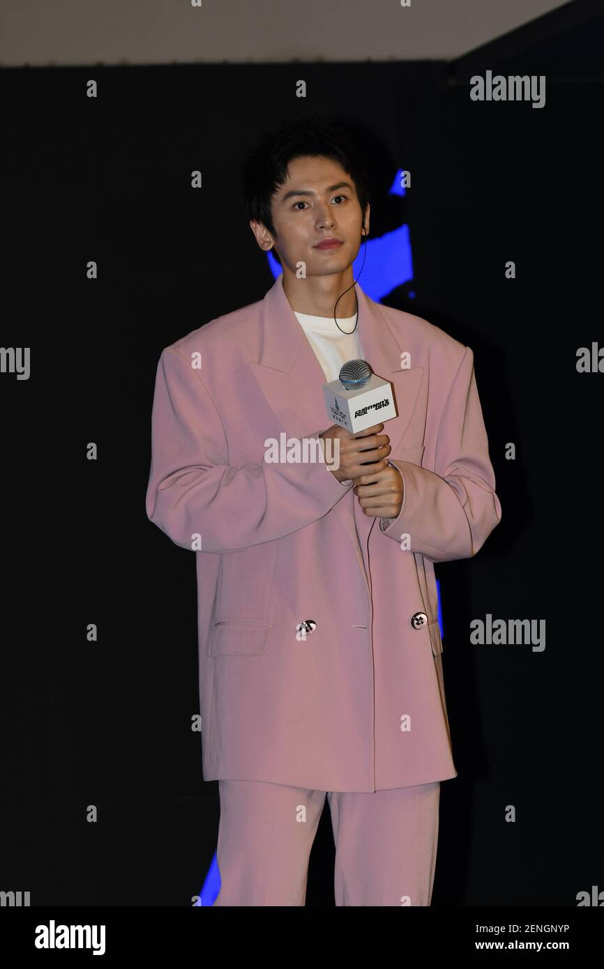 Chinese actor Zhang Zhehan, wearing pink suit, interacts with concert ...