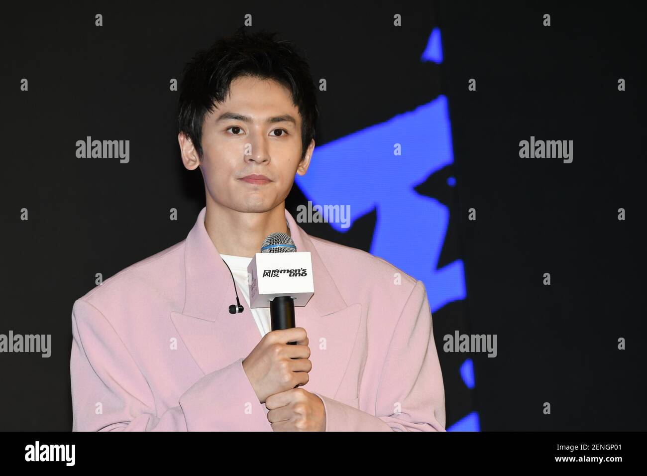 Chinese actor Zhang Zhehan, wearing pink suit, interacts with concert ...