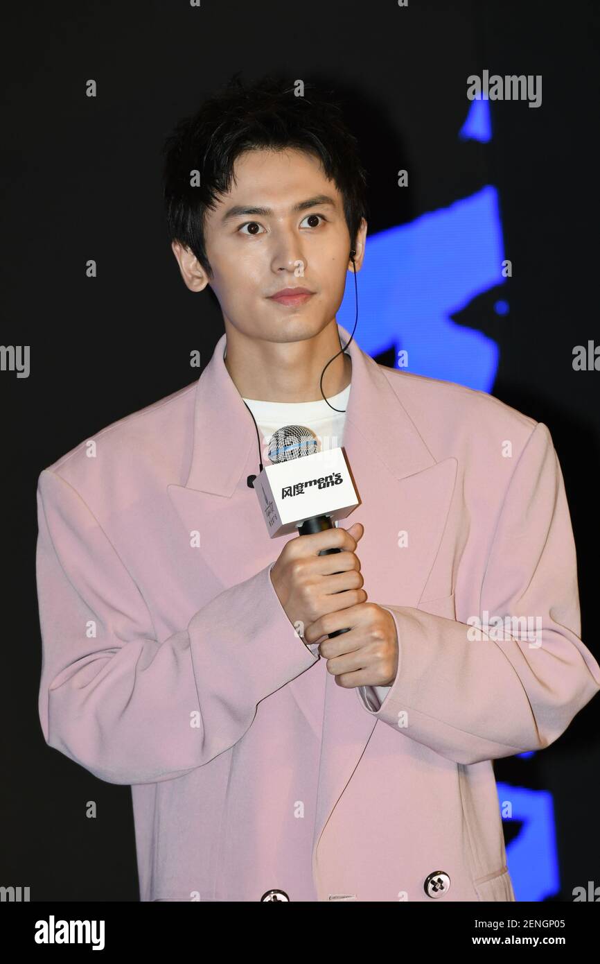 Chinese actor Zhang Zhehan, wearing pink suit, interacts with concert ...
