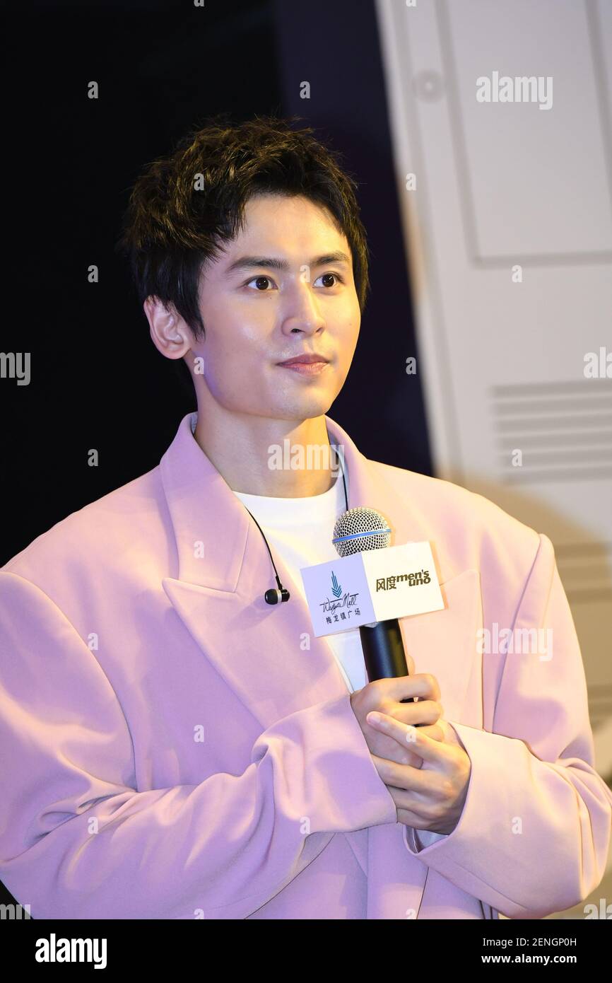 Chinese actor Zhang Zhehan, wearing pink suit, interacts with concert ...