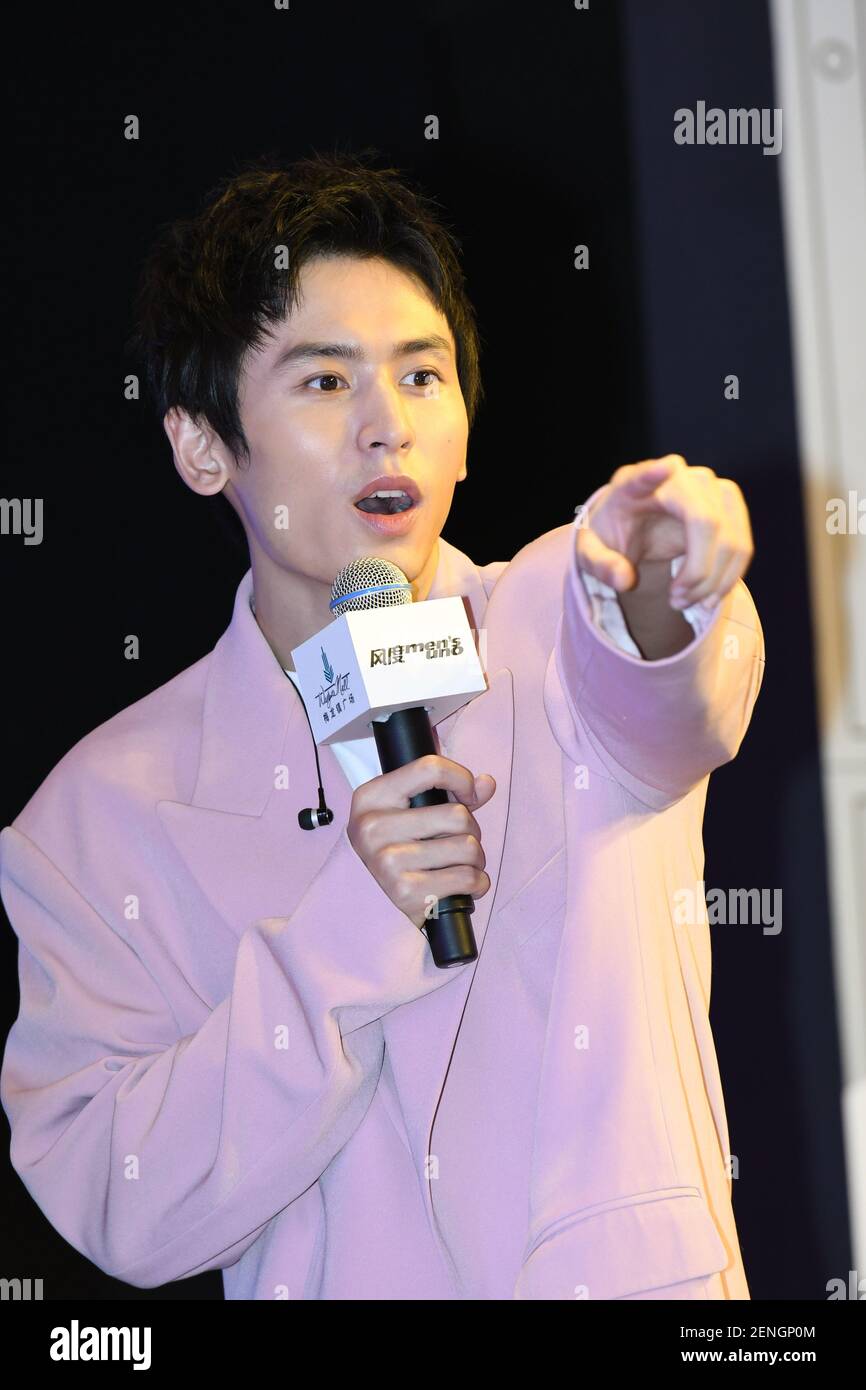 Chinese actor Zhang Zhehan, wearing pink suit, interacts with concert ...