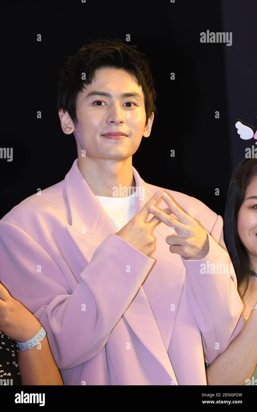 Chinese actor Zhang Zhehan, wearing pink suit, interacts with concert ...