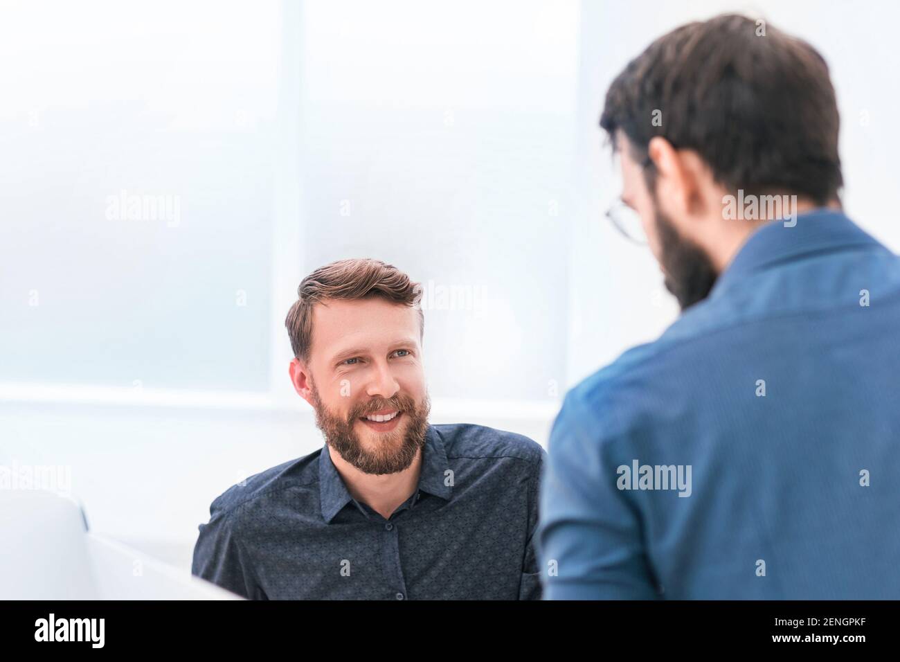 two successful business people on an office background Stock Photo - Alamy