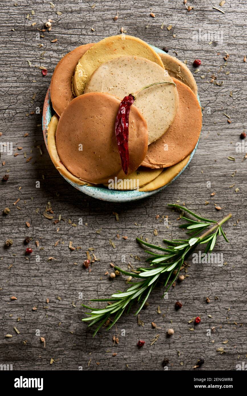 high angle view of some different cold cuts made of tofu in a green ...