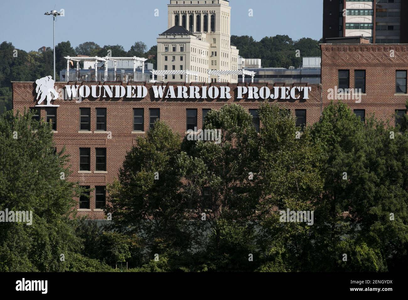 A logo sign outside of a facility occupied by Wounded Warrior Project ...