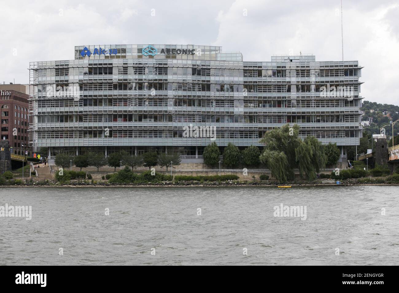 A logo sign outside of the headquarters of the Alcoa Corporation and ...