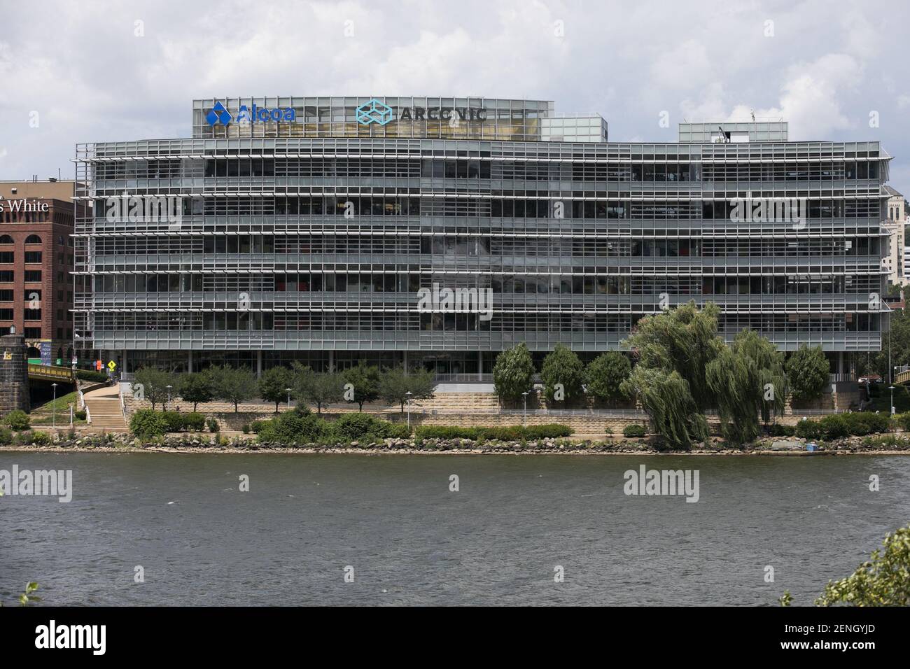 A logo sign outside of the headquarters of the Alcoa Corporation and ...