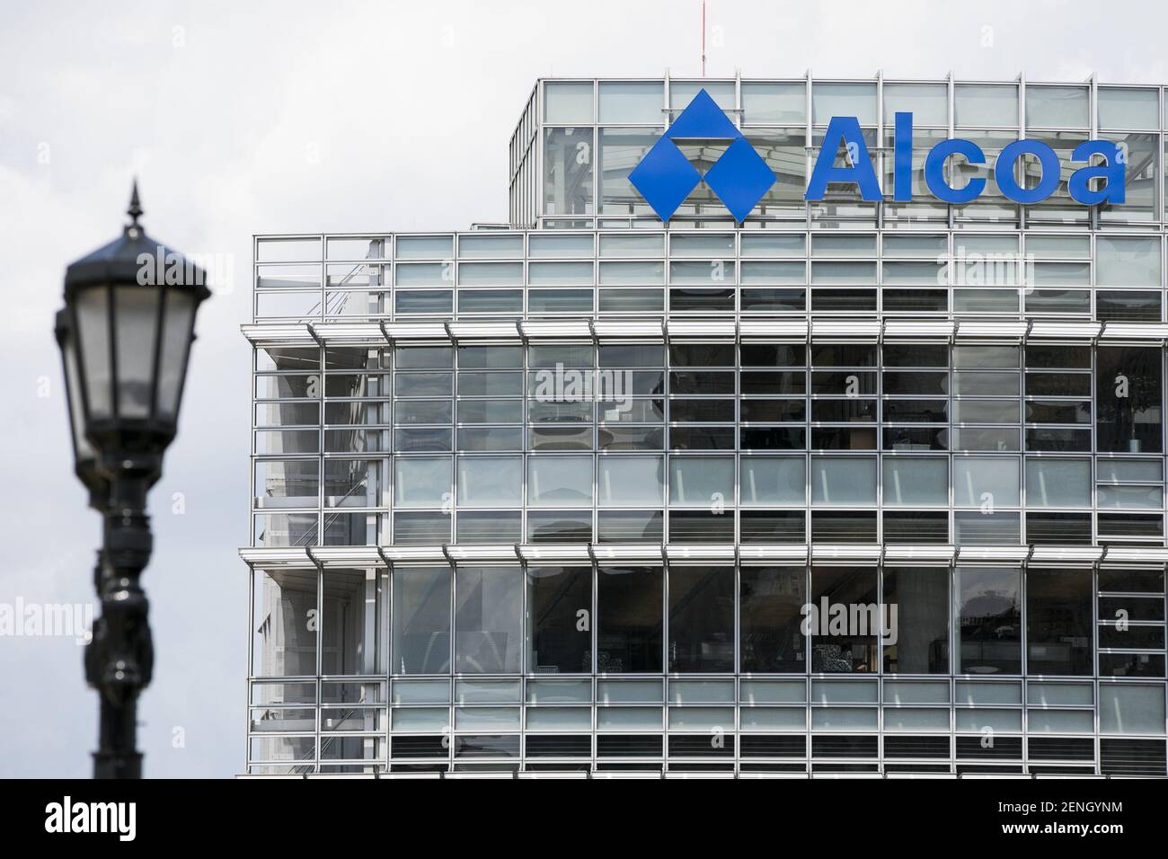 A logo sign outside of the headquarters of the Alcoa Corporation in ...