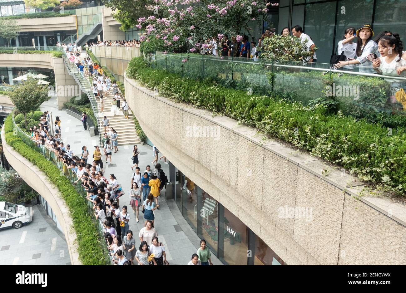 Chinese fans crowd a shopping mall to support singer and actor Karry ...