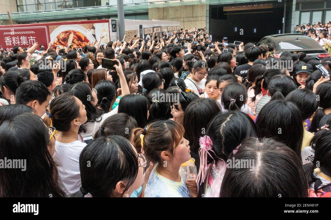 Chinese fans crowd a shopping mall to support singer and actor Karry ...