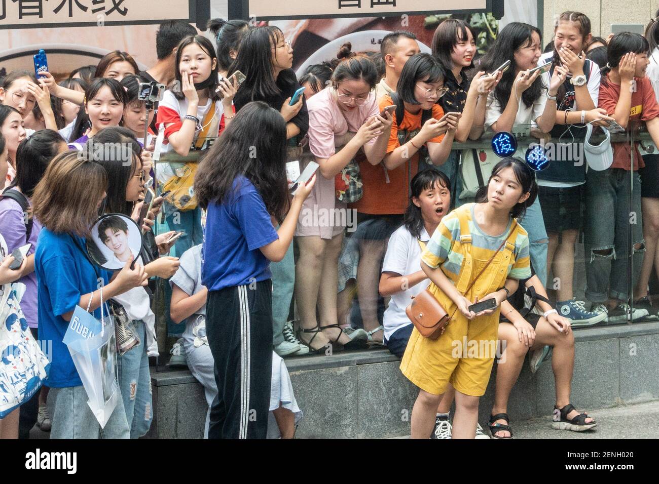 Chinese fans crowd a shopping mall to support singer and actor Karry ...