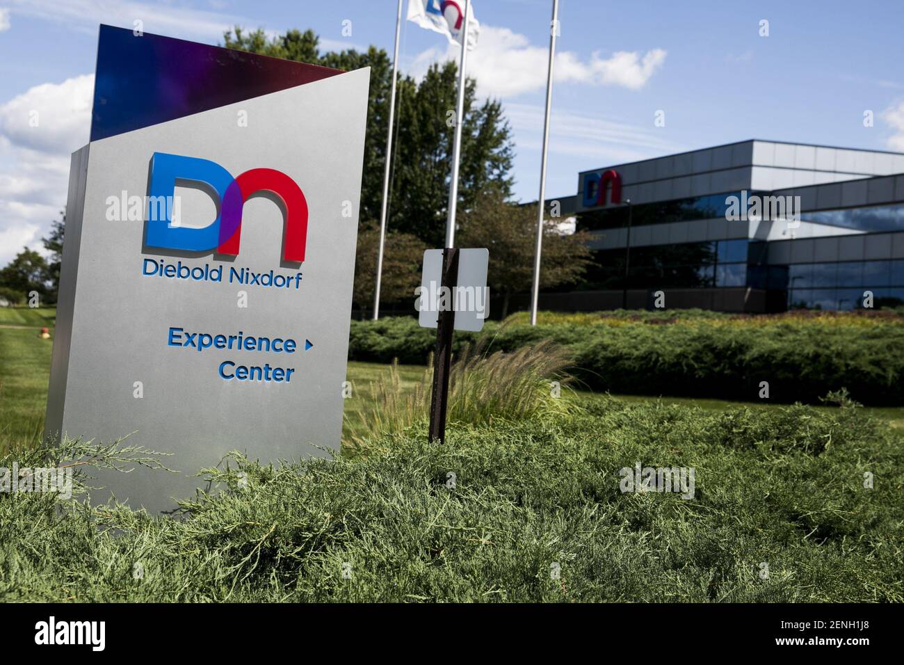 A logo sign outside of the headquarters of Diebold Nixdorf in North ...