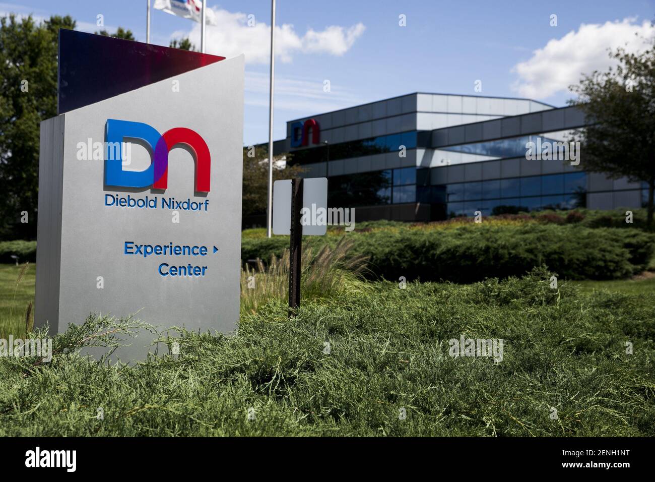 A logo sign outside of the headquarters of Diebold Nixdorf in North ...