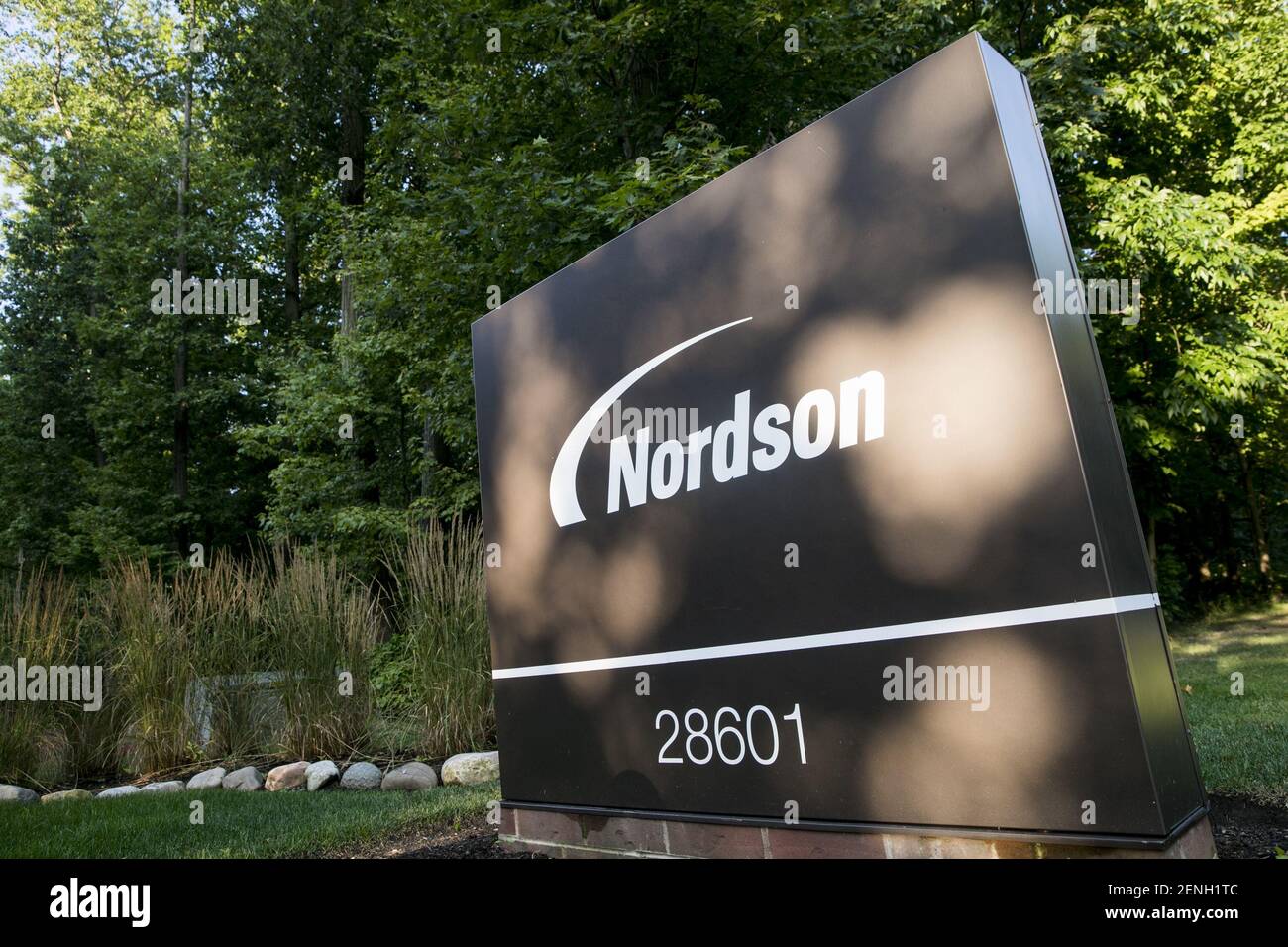 A logo sign outside of the headquarters of the Nordson Corporation in ...