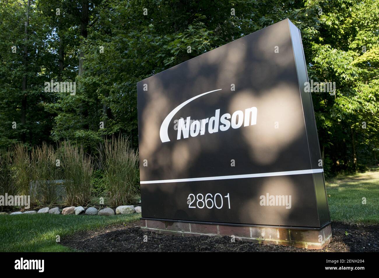 A logo sign outside of the headquarters of the Nordson Corporation in ...
